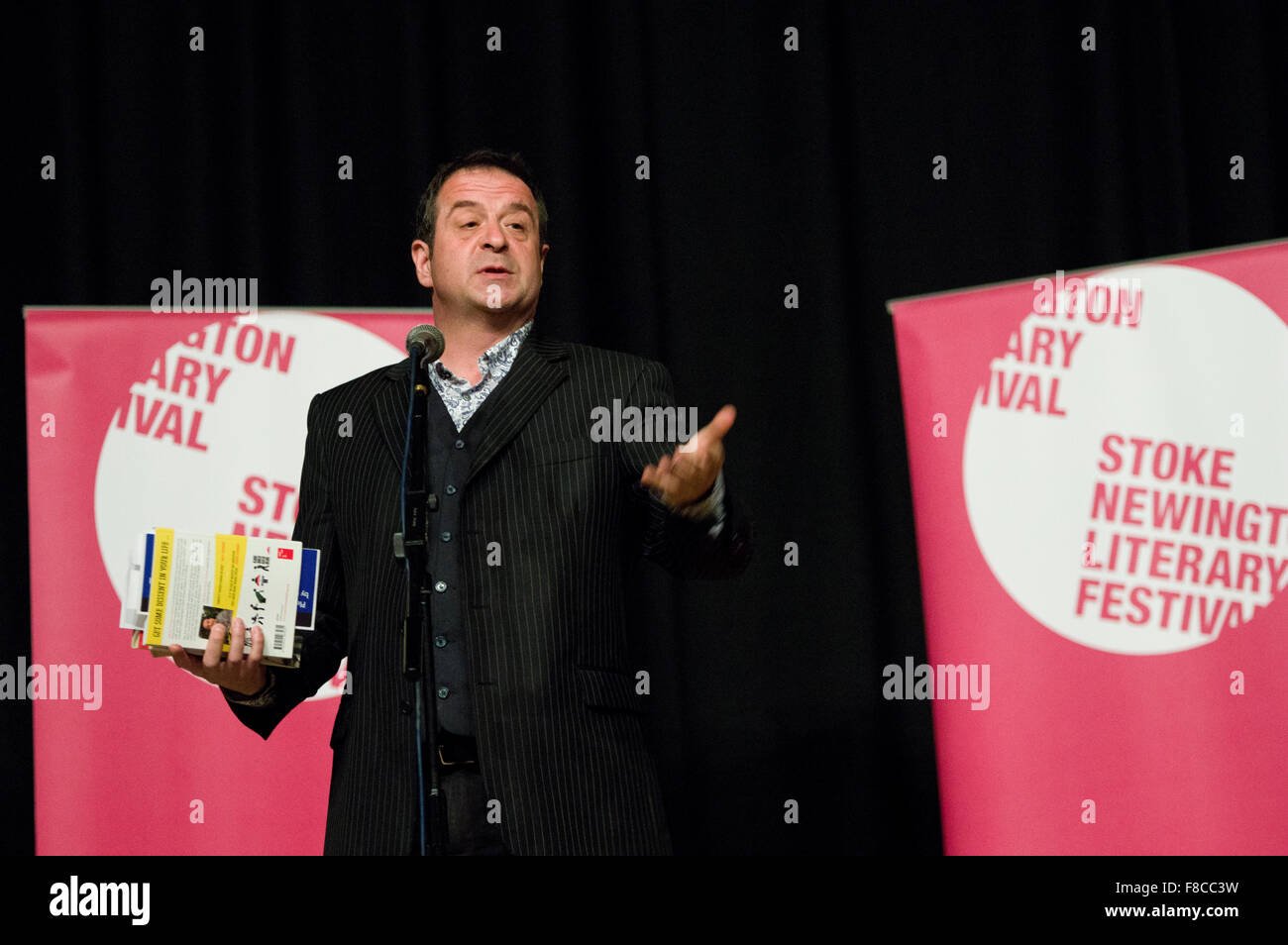 Comedian Mark Thomas reading from his book The People's Manifesto in ...