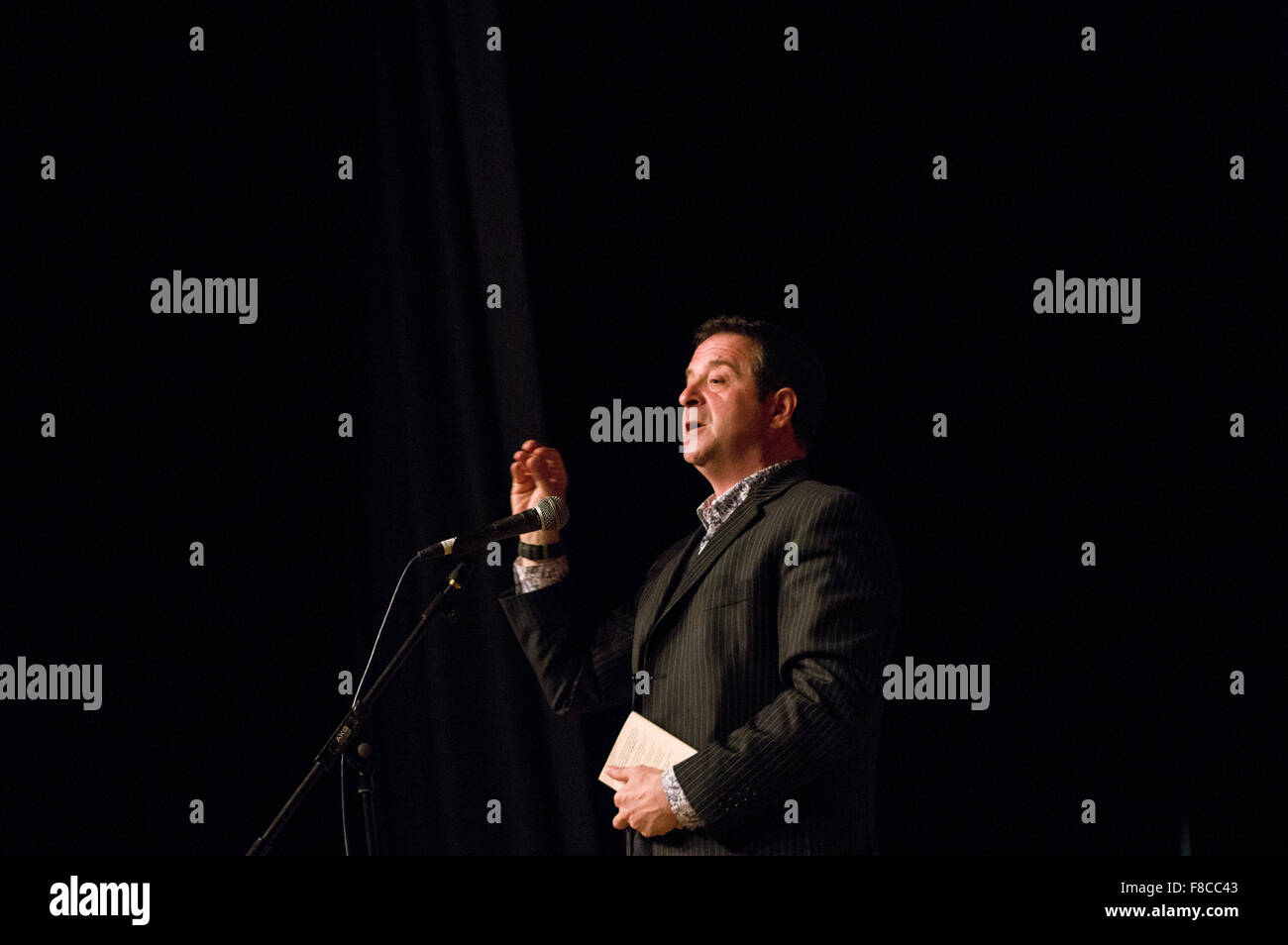 Comedian Mark Thomas reading from his book The People's Manifesto in ...