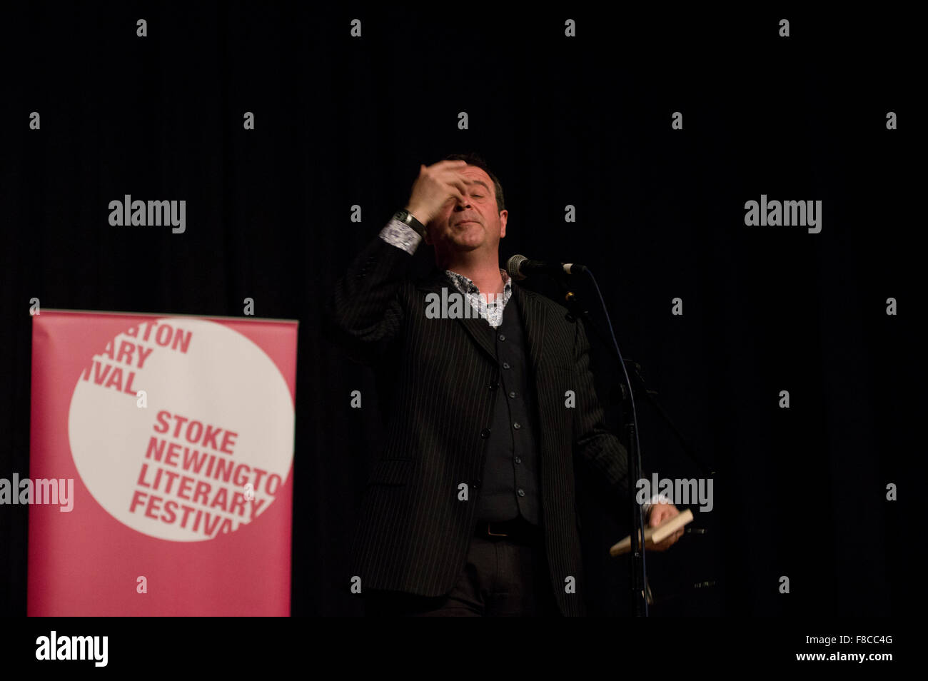 Comedian Mark Thomas reading from his book The People's Manifesto in ...