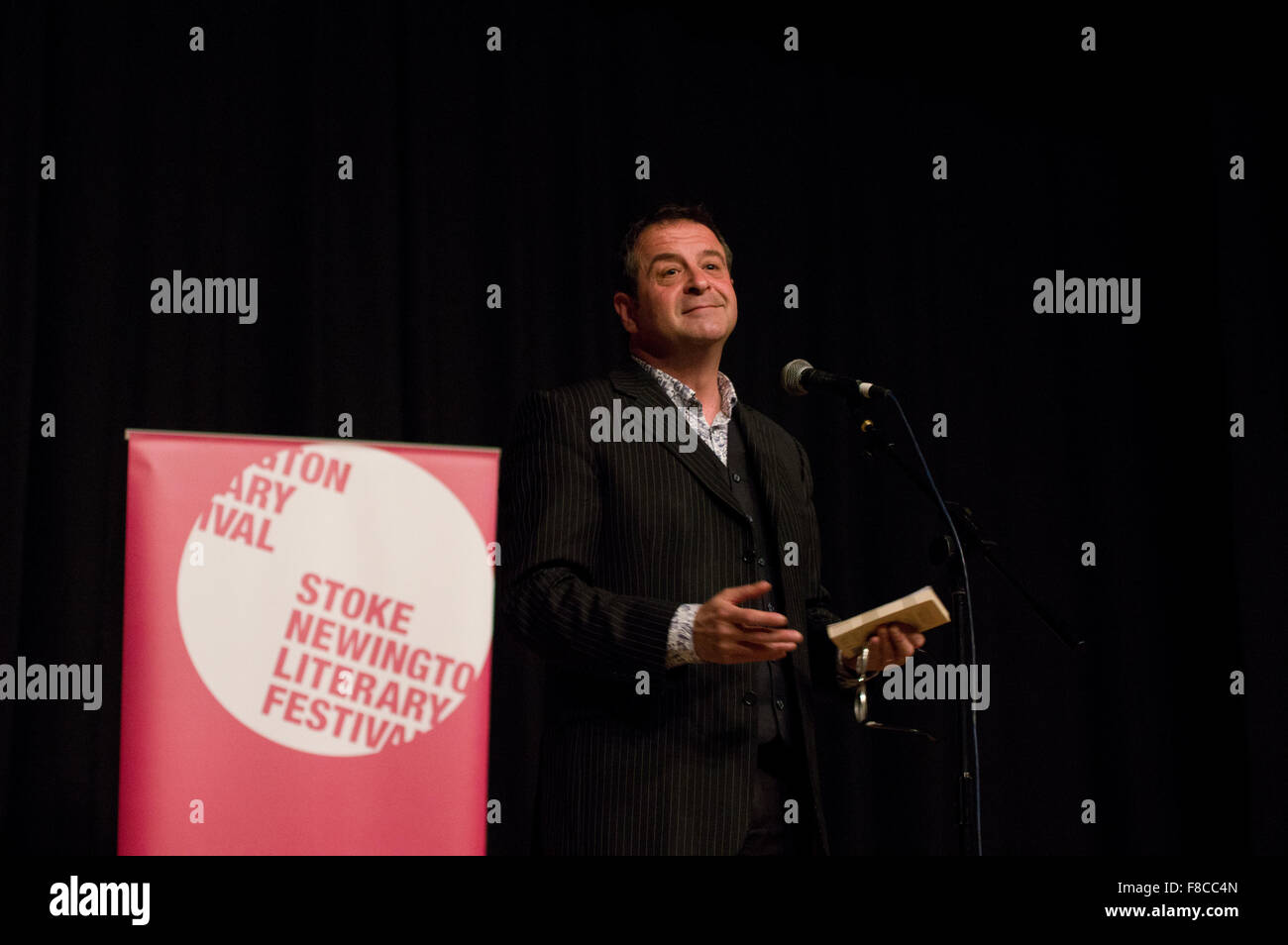 Comedian Mark Thomas reading from his book The People's Manifesto in ...