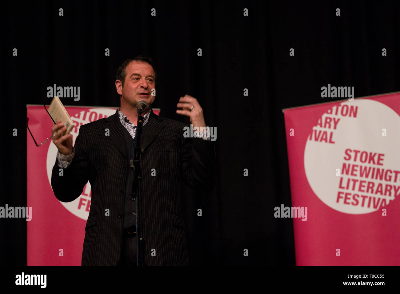 Comedian Mark Thomas reading from his book The People's Manifesto in ...