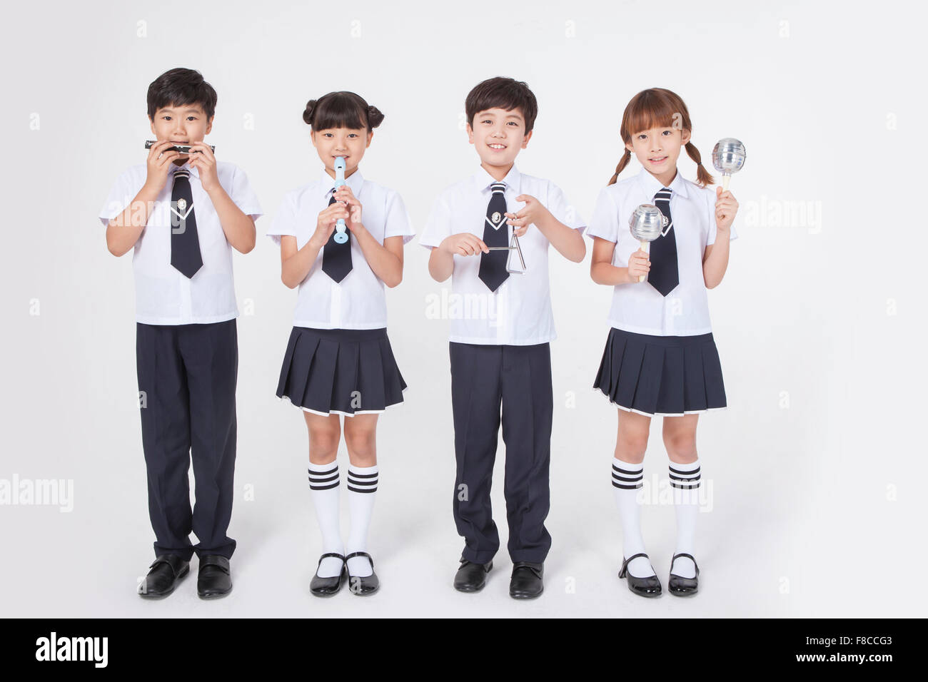 Holding standing musical instrument looking at camera hi-res stock ...