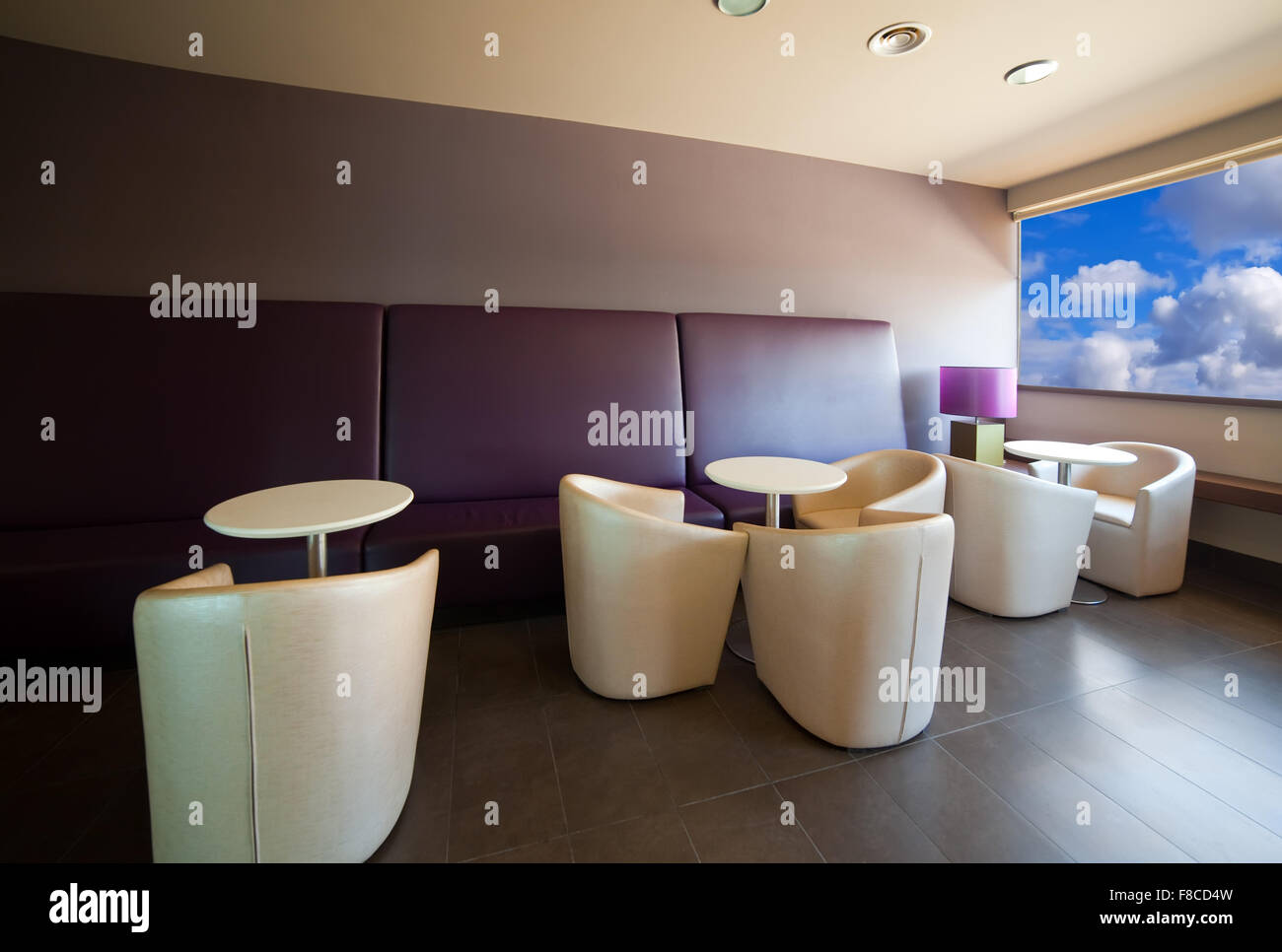 Interior of comfortable cafe with leather arm-chair Stock Photo - Alamy