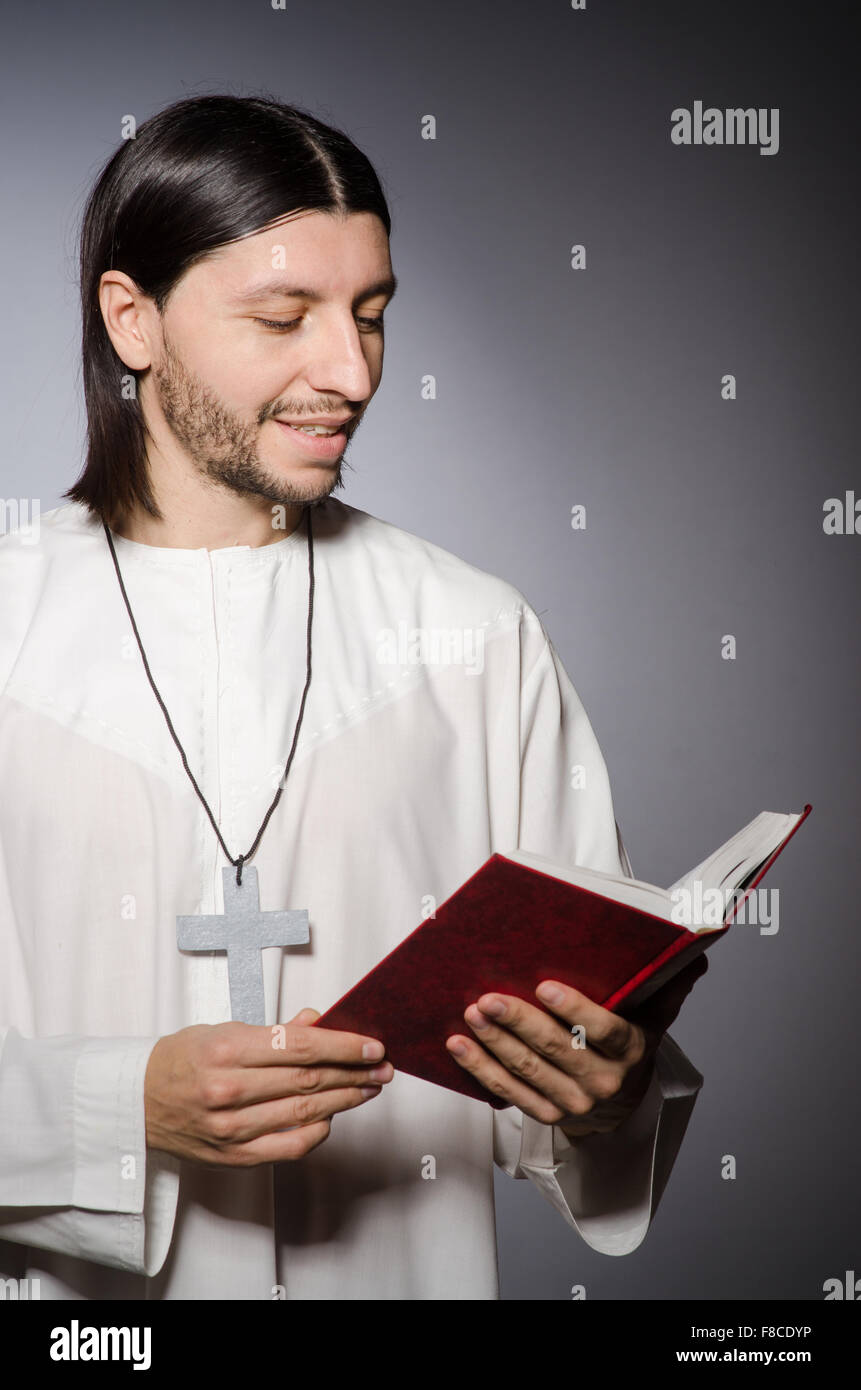 Priest man in religious concept Stock Photo - Alamy