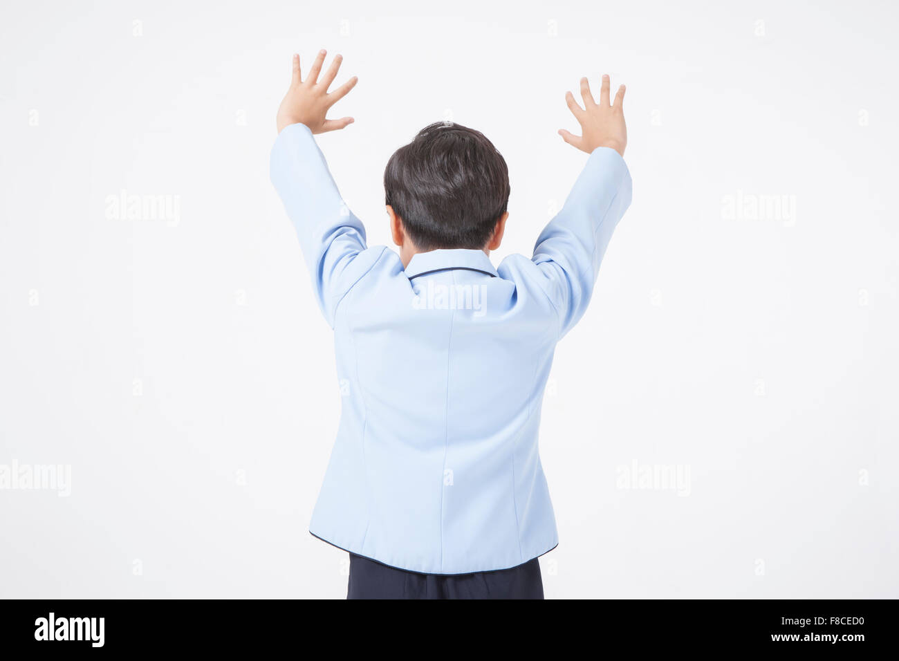 Back appearance of an elementary school boy in school uniforms ...