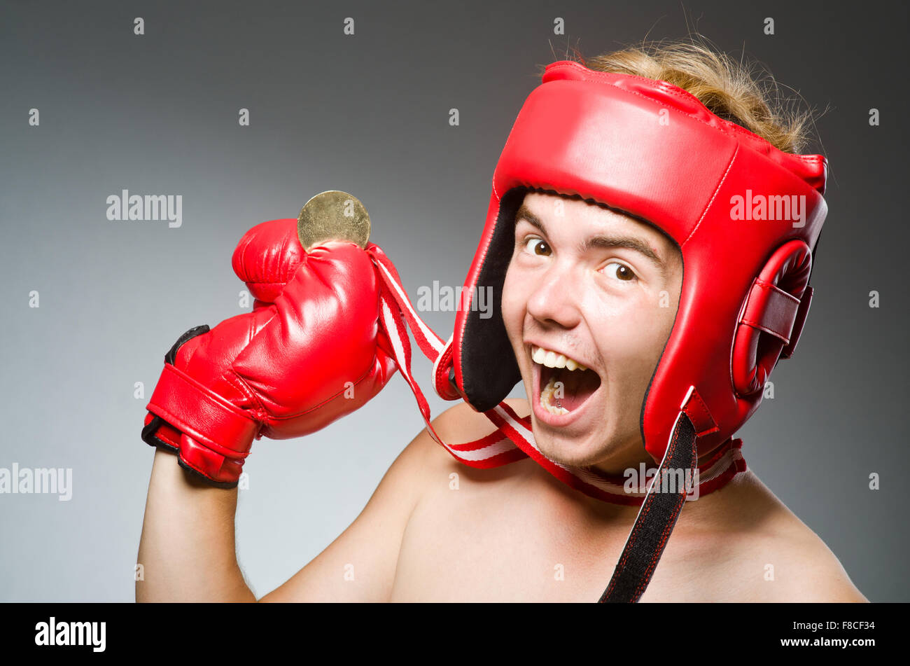 Funny boxer with winning gold medal Stock Photo - Alamy