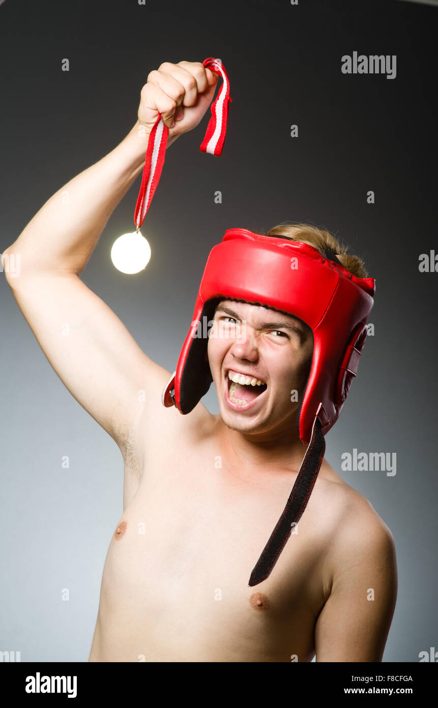 Funny boxer with winning gold medal Stock Photo - Alamy