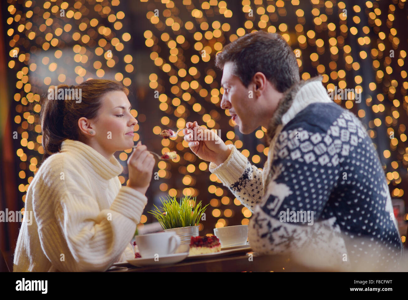 romantic evening date in restaurant happy young couple with wine glass ...