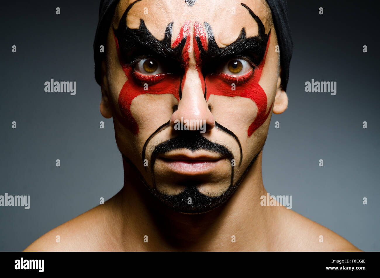 Man with face covered with facepaint Stock Photo - Alamy