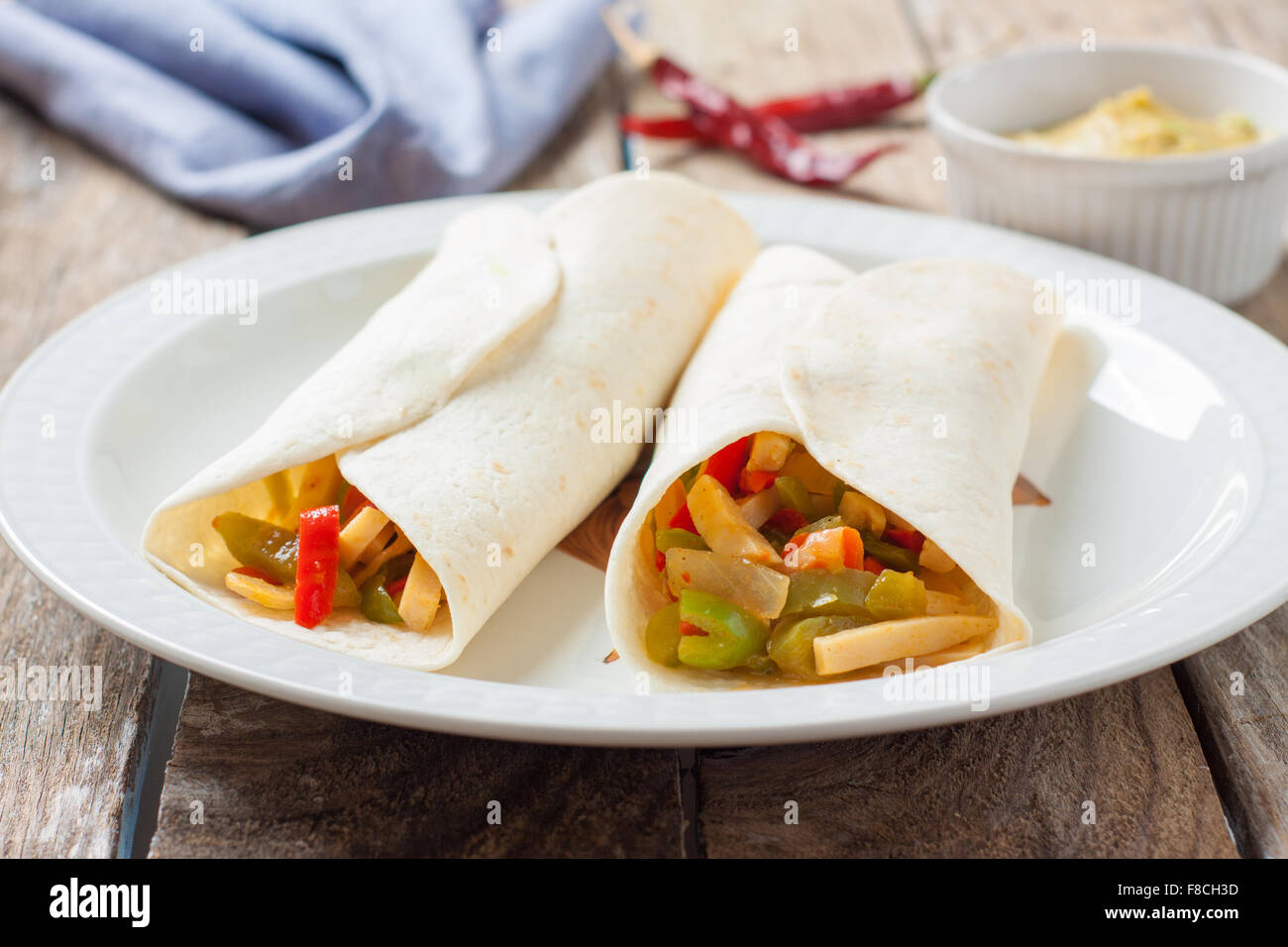 mexican style wrap filled with chicken and vegetables Stock Photo - Alamy