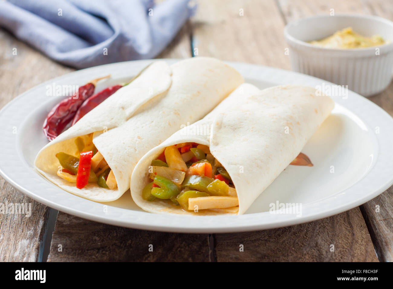 mexican style wrap filled with chicken and vegetables Stock Photo - Alamy