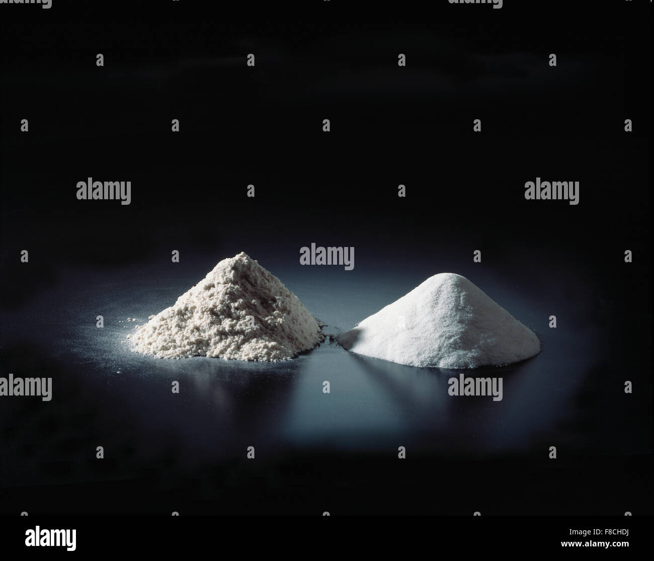 little mountain of white powder on black background Stock Photo - Alamy