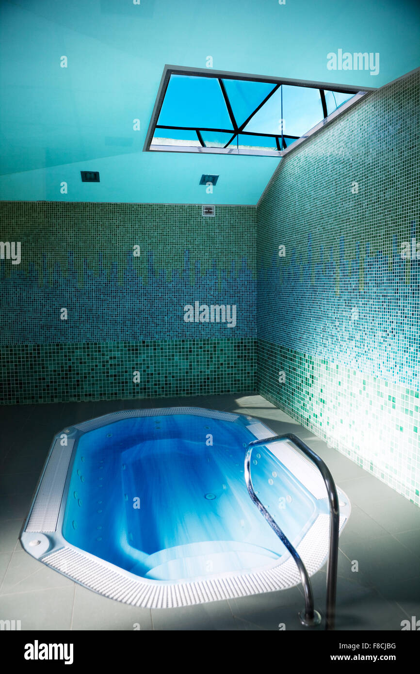 Empty indoor jacuzzi and window Stock Photo - Alamy