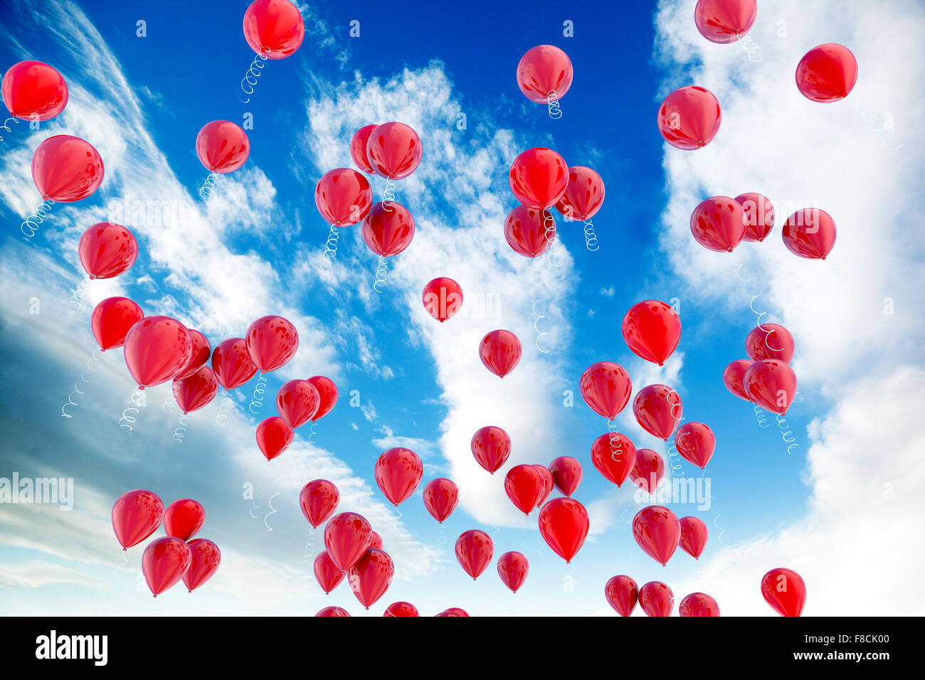 Red balloons floating over the blue sky Stock Photo - Alamy