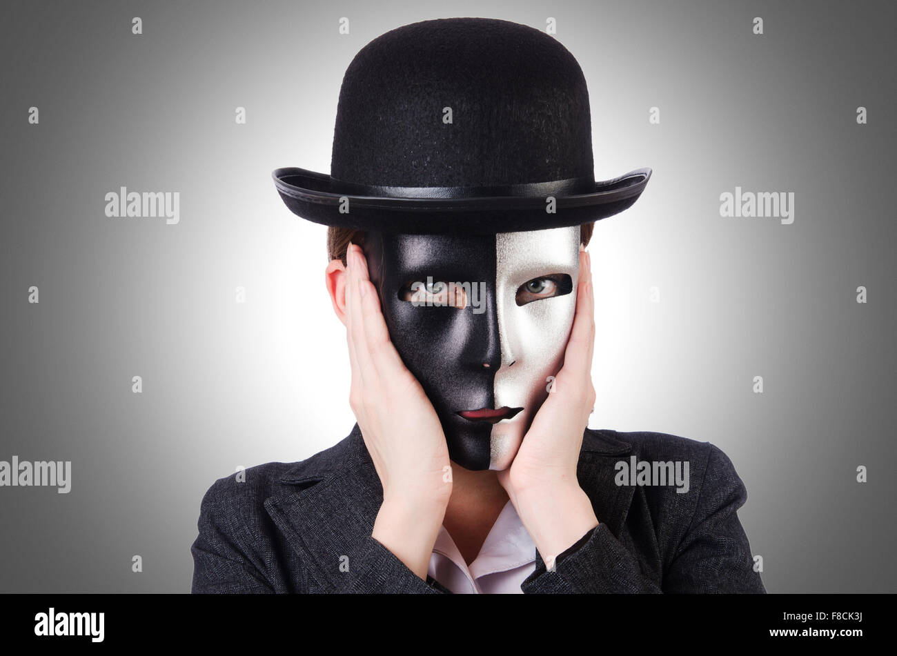 Woman with mask in hypocrisy concept Stock Photo - Alamy