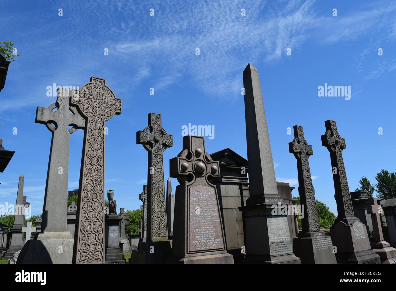 celtic crosses and other tombstones at glasgow necropolis on a sunny ...