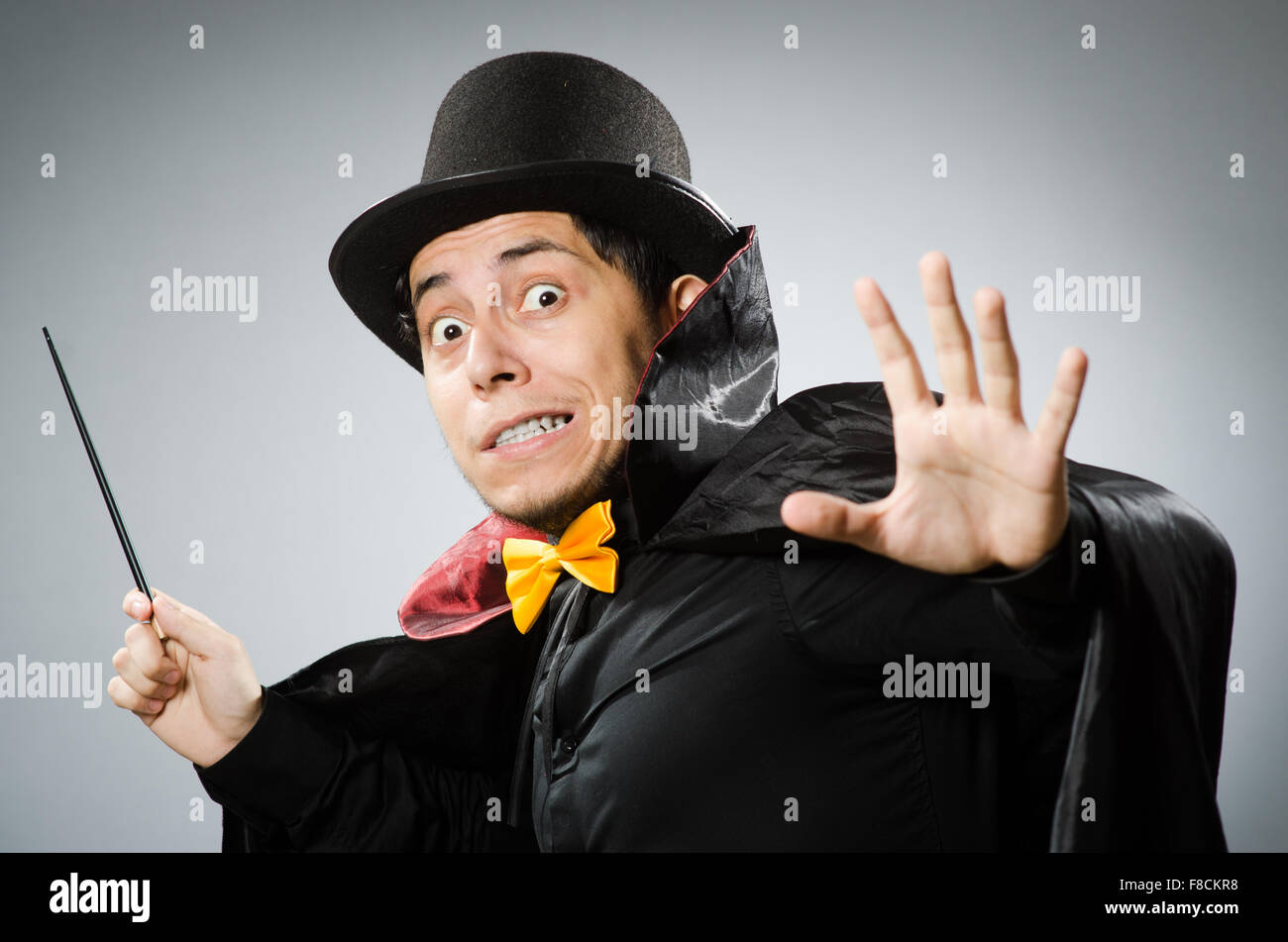 Funny magician man with wand and hat Stock Photo - Alamy
