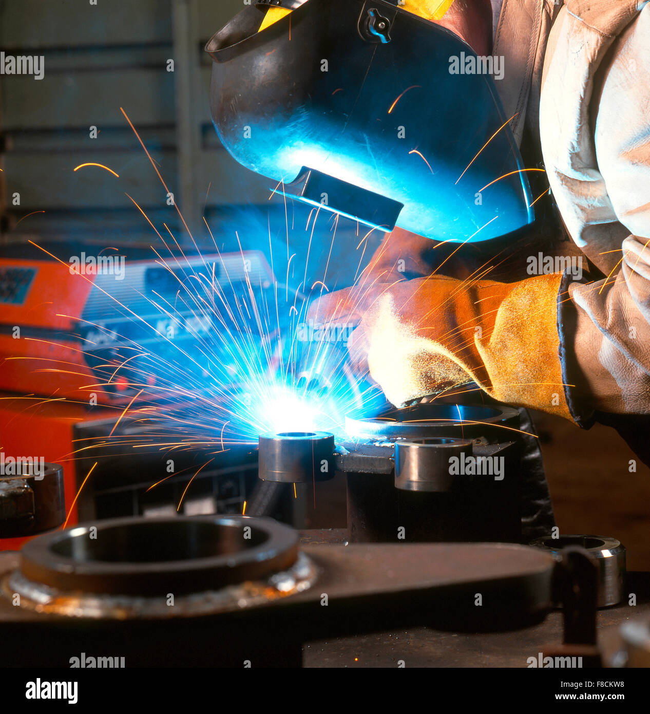 welding specialists welding a big piece of metal Stock Photo - Alamy
