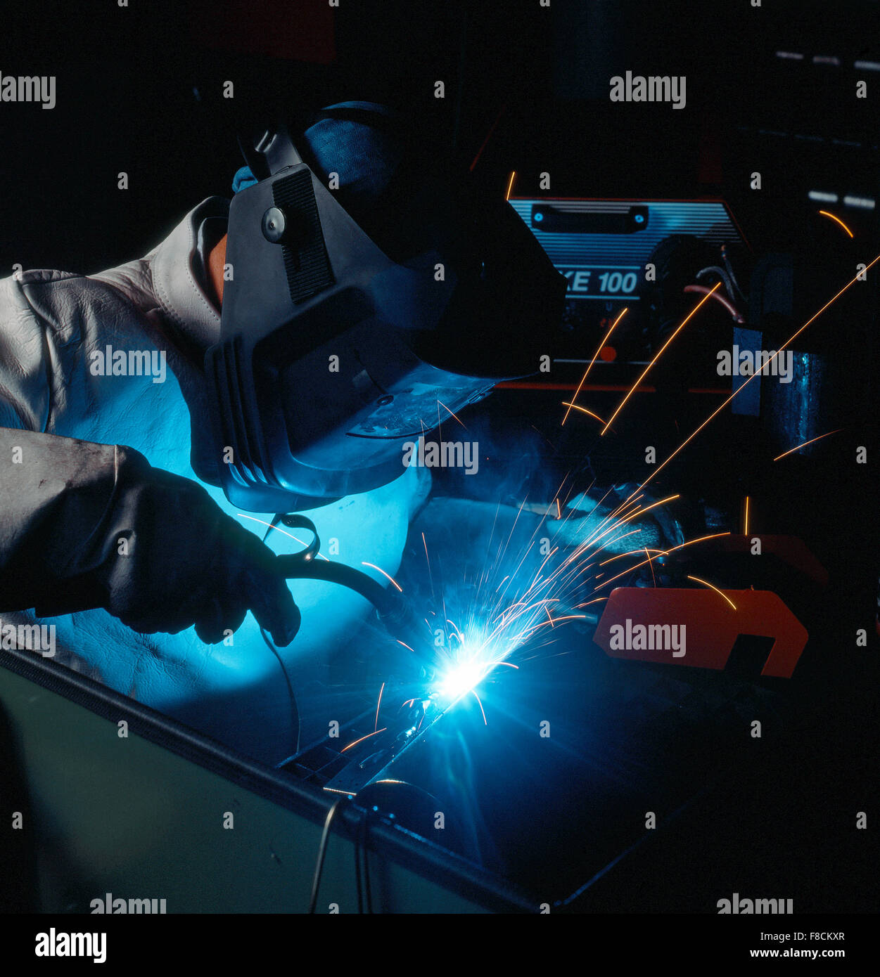 welding specialists welding a big piece of metal Stock Photo - Alamy