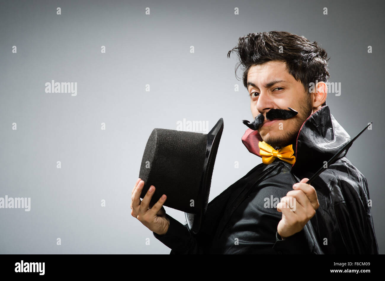 Funny magician man with wand and hat Stock Photo - Alamy