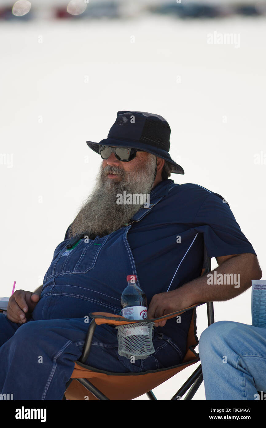 Old man with long barb working the World of Speed Stock Photo - Alamy