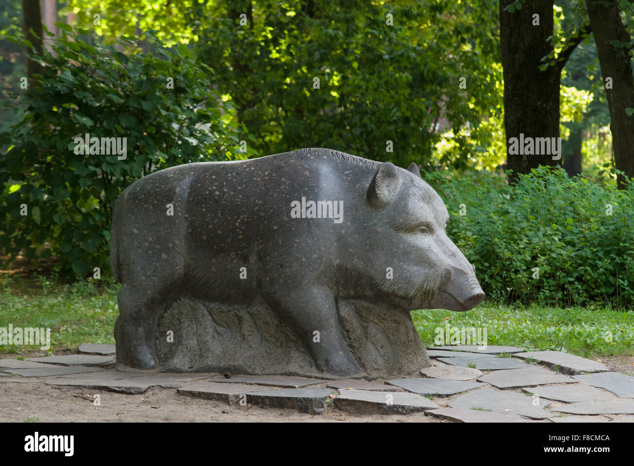 the monument from a gray stone is built in honor of a wild pig Stock ...