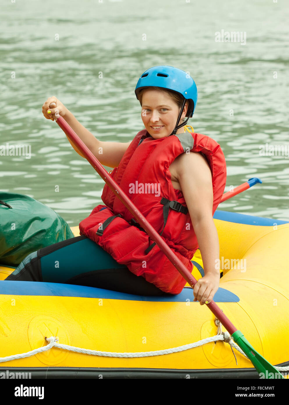 Girl with a paddle on the raft Stock Photo - Alamy