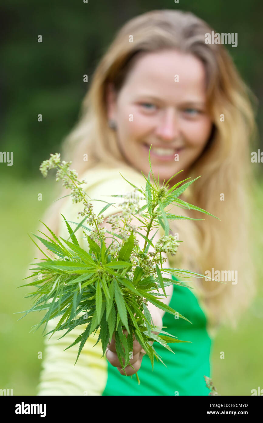 Woman holds fresh cannabis bouquet Stock Photo - Alamy