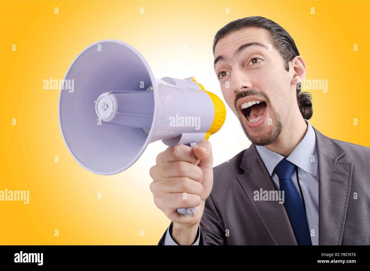 Man shouting and yelling with loudspeaker Stock Photo - Alamy