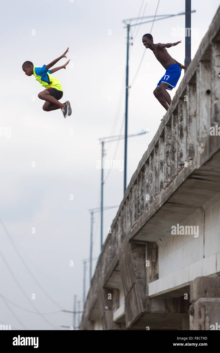 Teenagers jumping back side from a bridge hi-res stock photography and ...