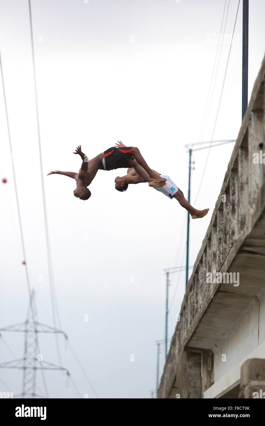 Teenagers jumping back side from a bridge, Ecuador Stock Photo - Alamy