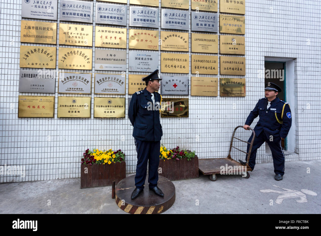 Police in front of signs, Shanghai Stock Photo - Alamy