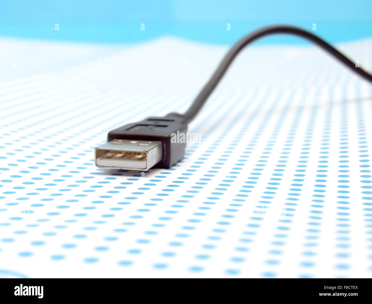 usb cable on dotted background Stock Photo - Alamy