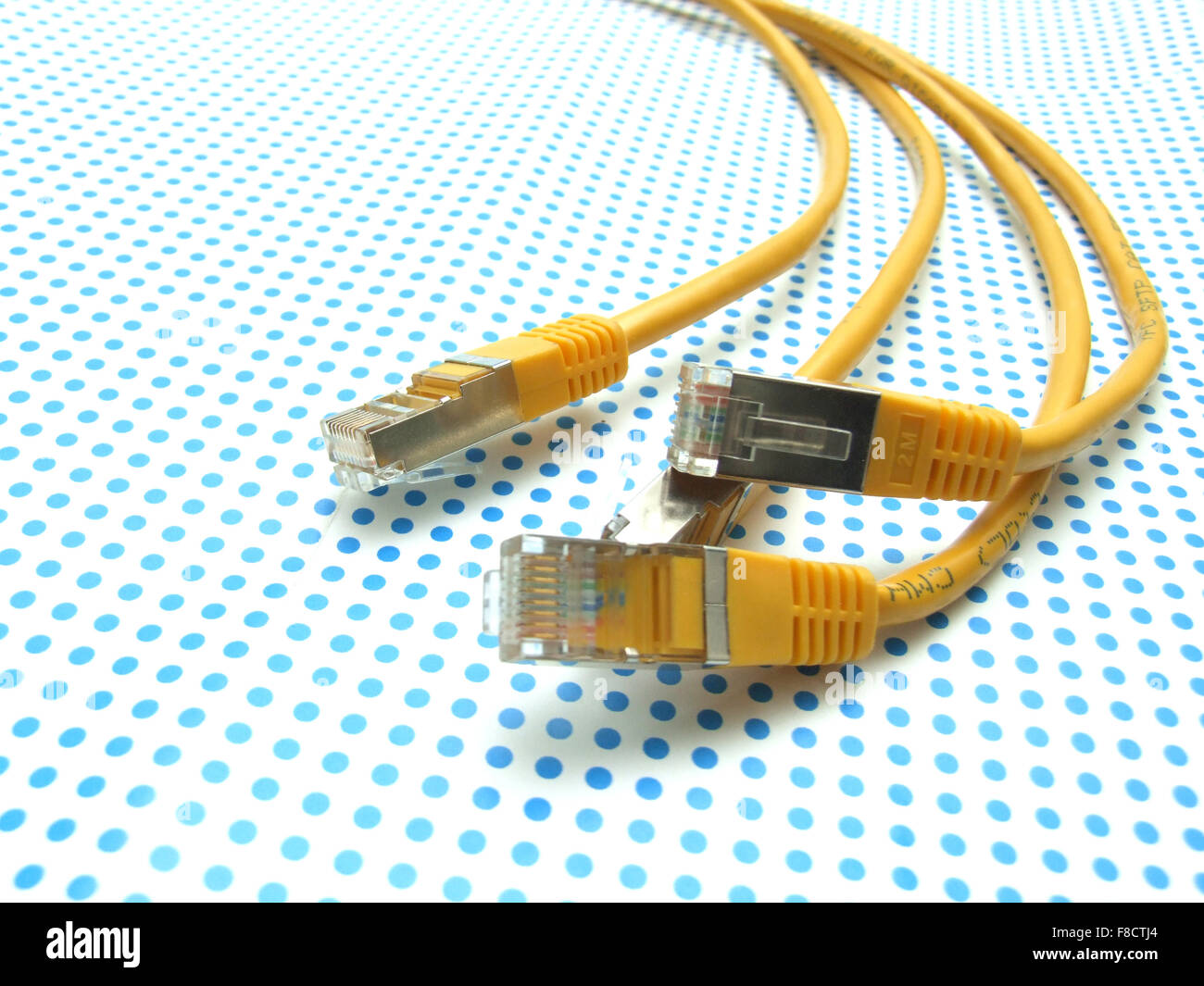 yellow ethernet cable on dotted background Stock Photo - Alamy