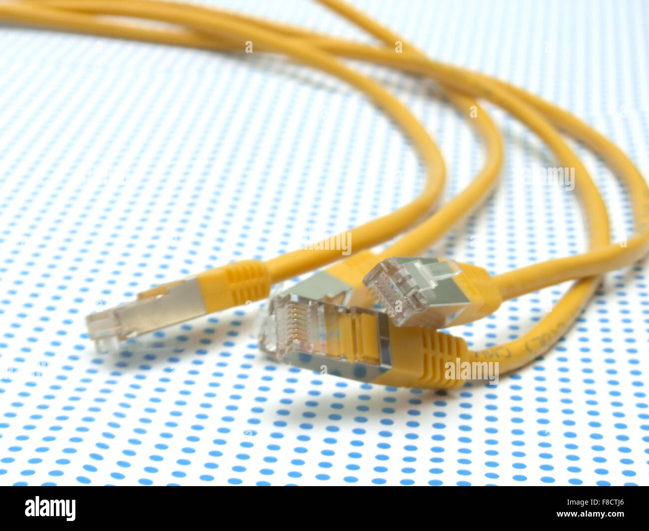 yellow ethernet cable on dotted background Stock Photo - Alamy