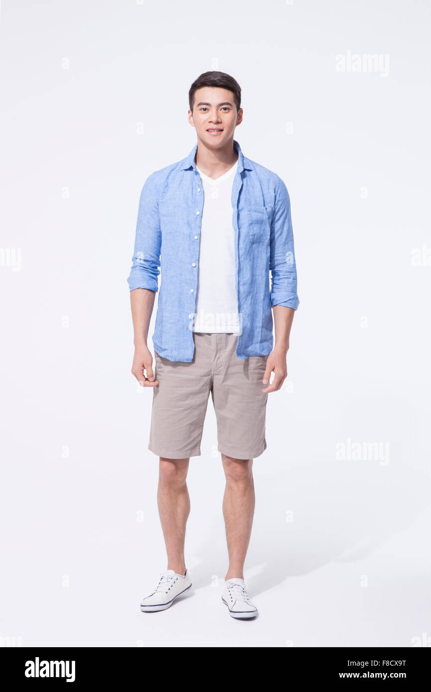 Man in casual outfits standing and staring forward Stock Photo - Alamy