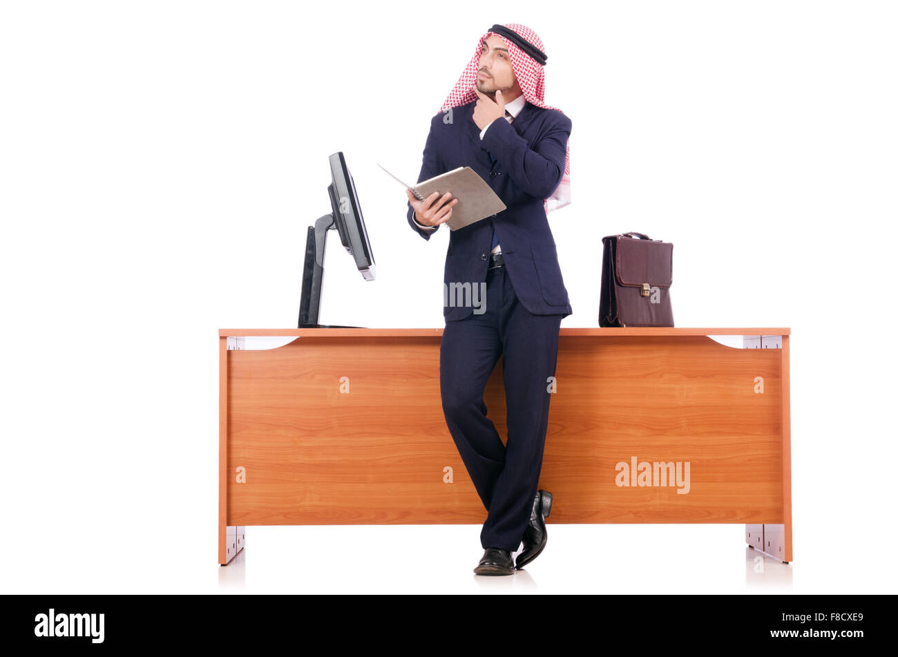 Arab man sitting at his desk Stock Photo - Alamy
