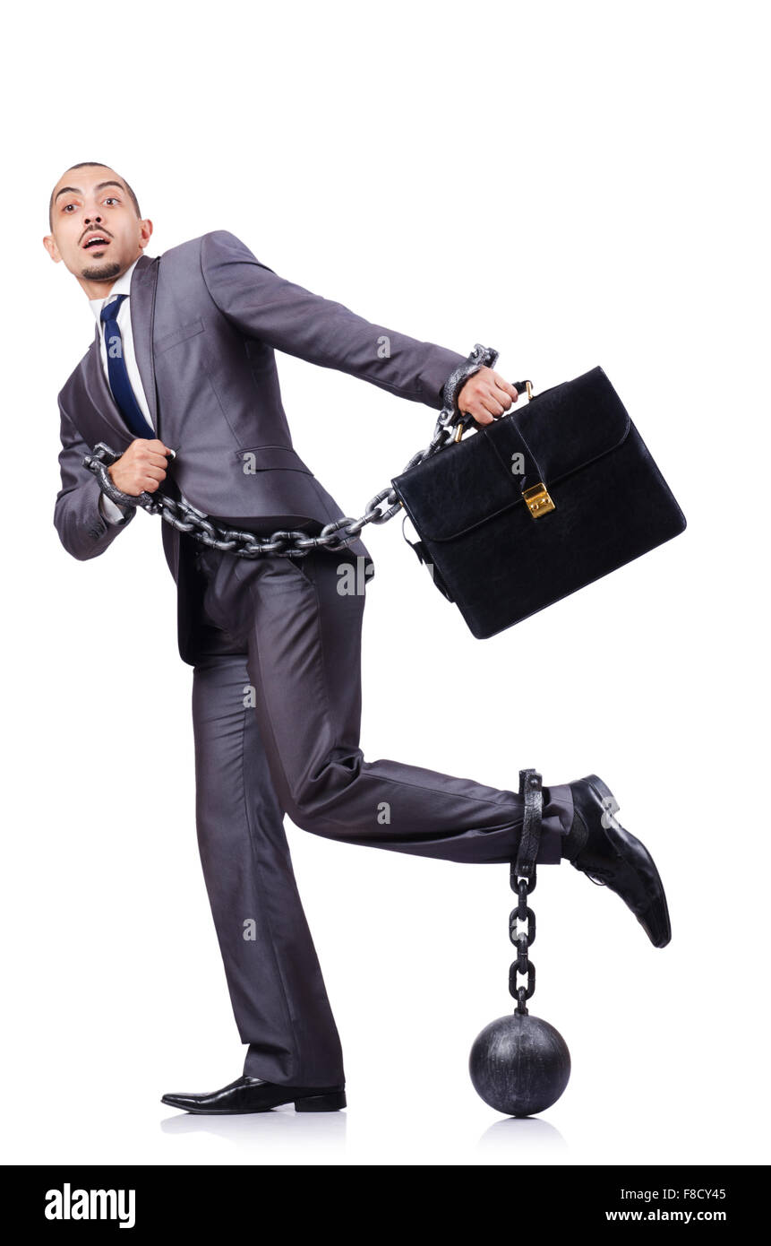 Businessman with shackles on white Stock Photo - Alamy
