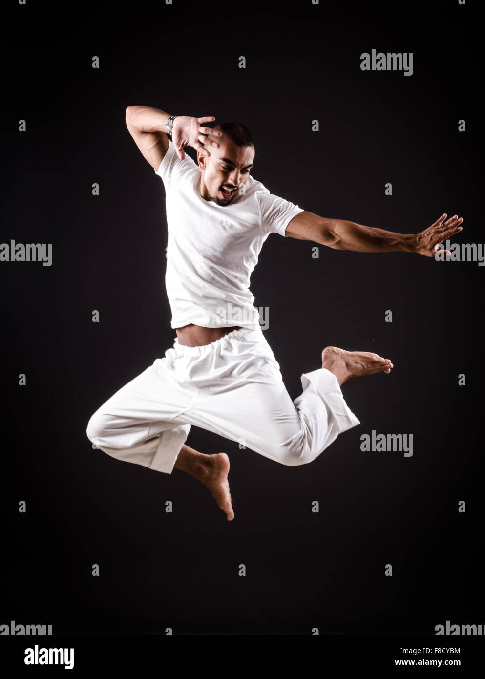 Dancer dancing dances in white clothing Stock Photo - Alamy