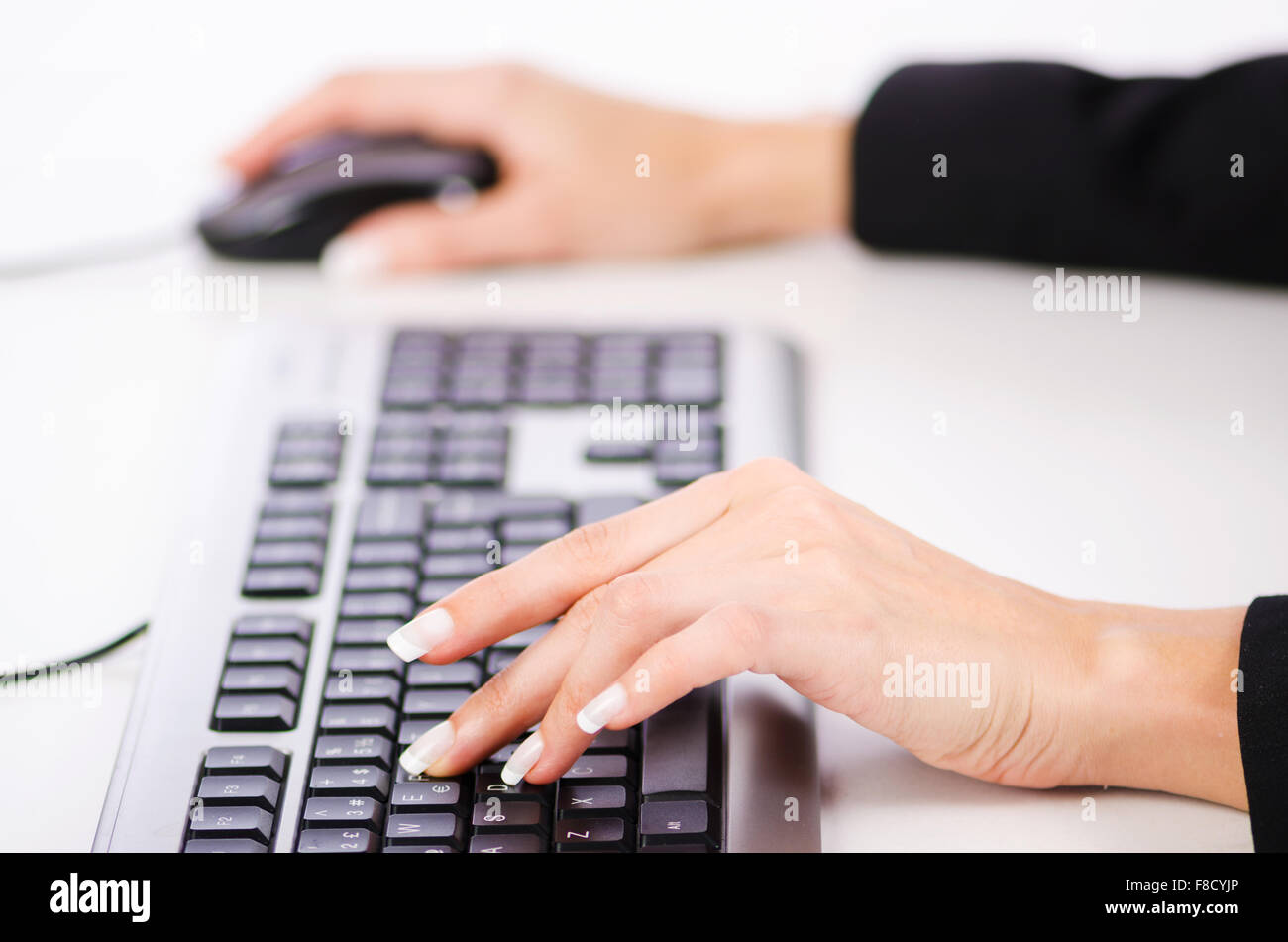 Hands working on the keyboard Stock Photo - Alamy