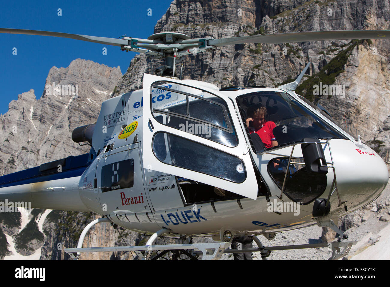 Mountain rescue helicopter in the italian Alps Stock Photo - Alamy