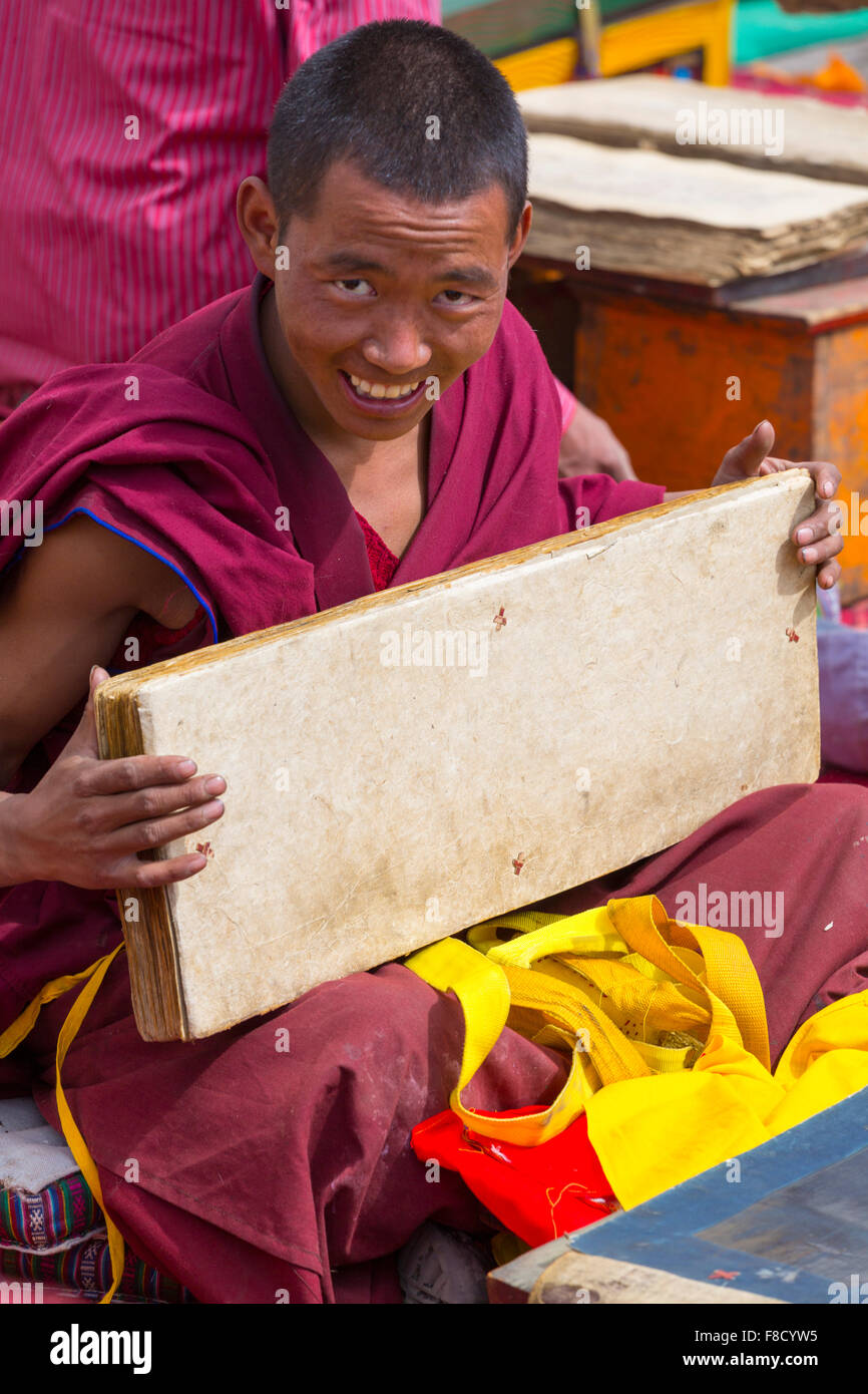 Tibetan Monk studying the ancient manuscripts Stock Photo - Alamy