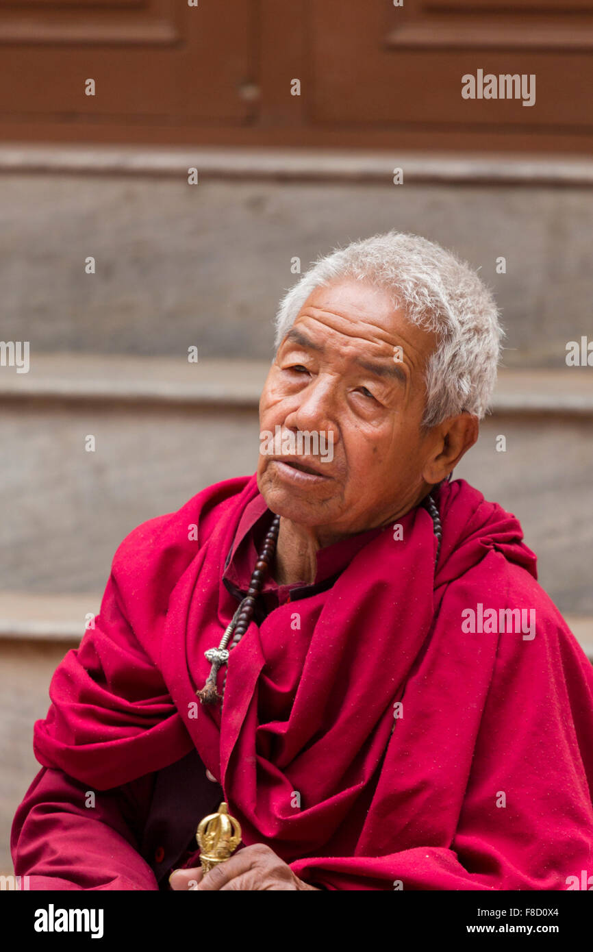Old monk praying in Kathmandu Stock Photo - Alamy