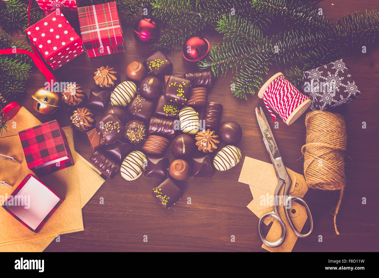 Wrapping assorted chocolates in small boxes for Christmas presents ...