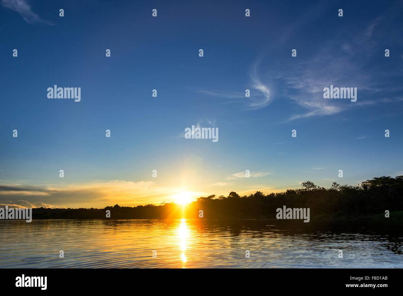 Beautiful blue and orange sunset over the Javari River in the Amazon ...