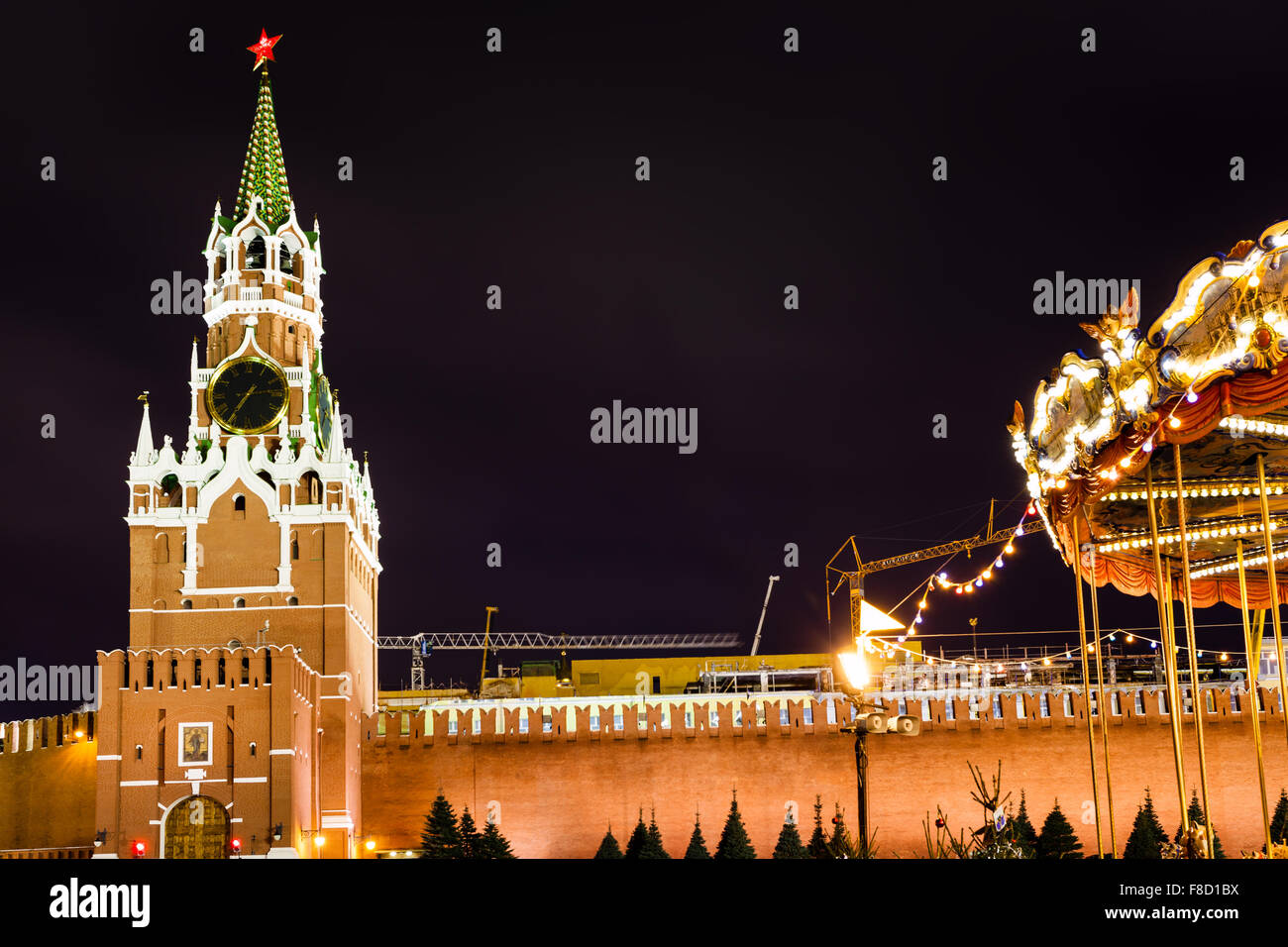 Spasskaya tower of Kremlin and Merry-go-round carousel on Red Square in ...