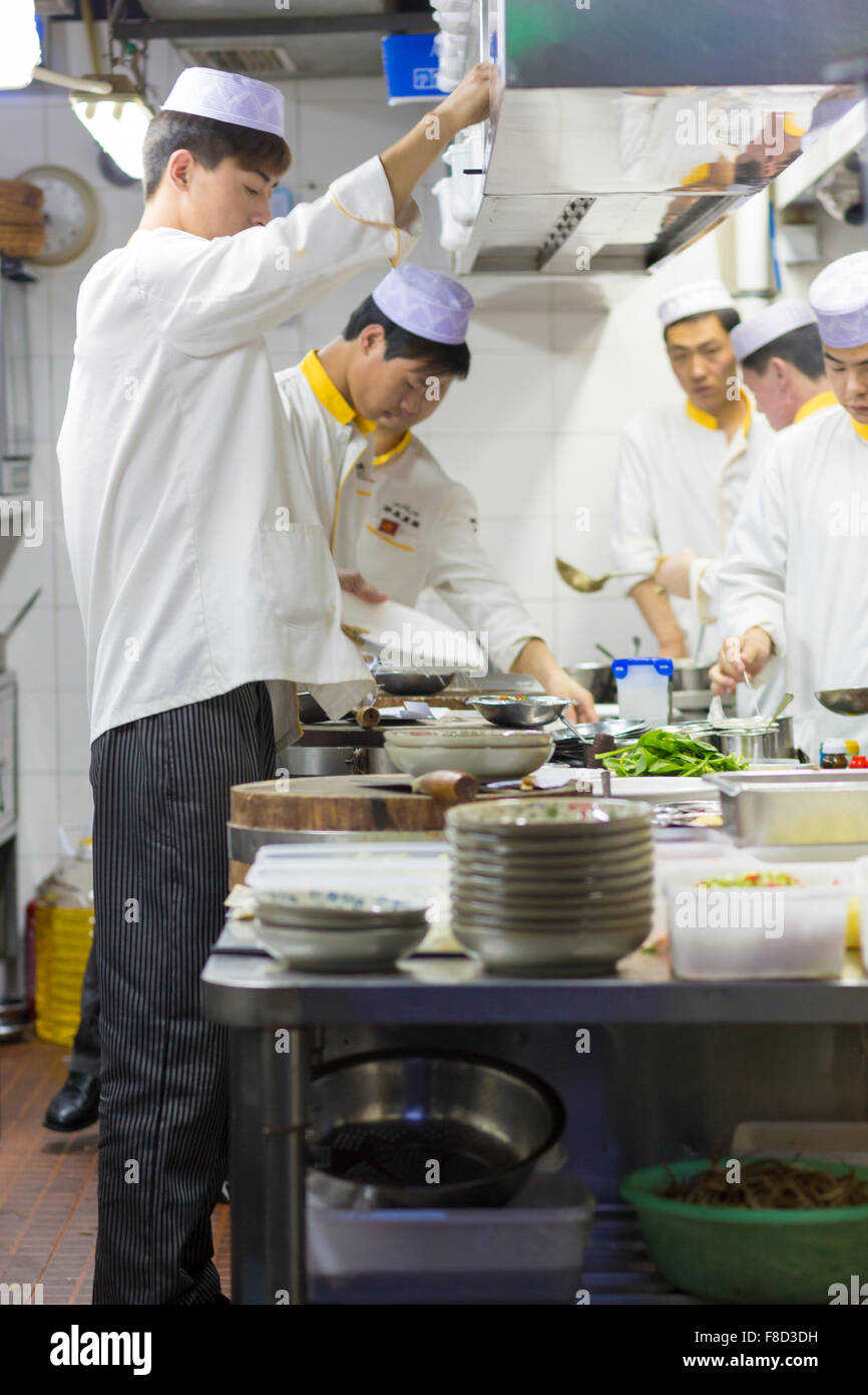 Chinese cooks at work, Shanghai Stock Photo - Alamy