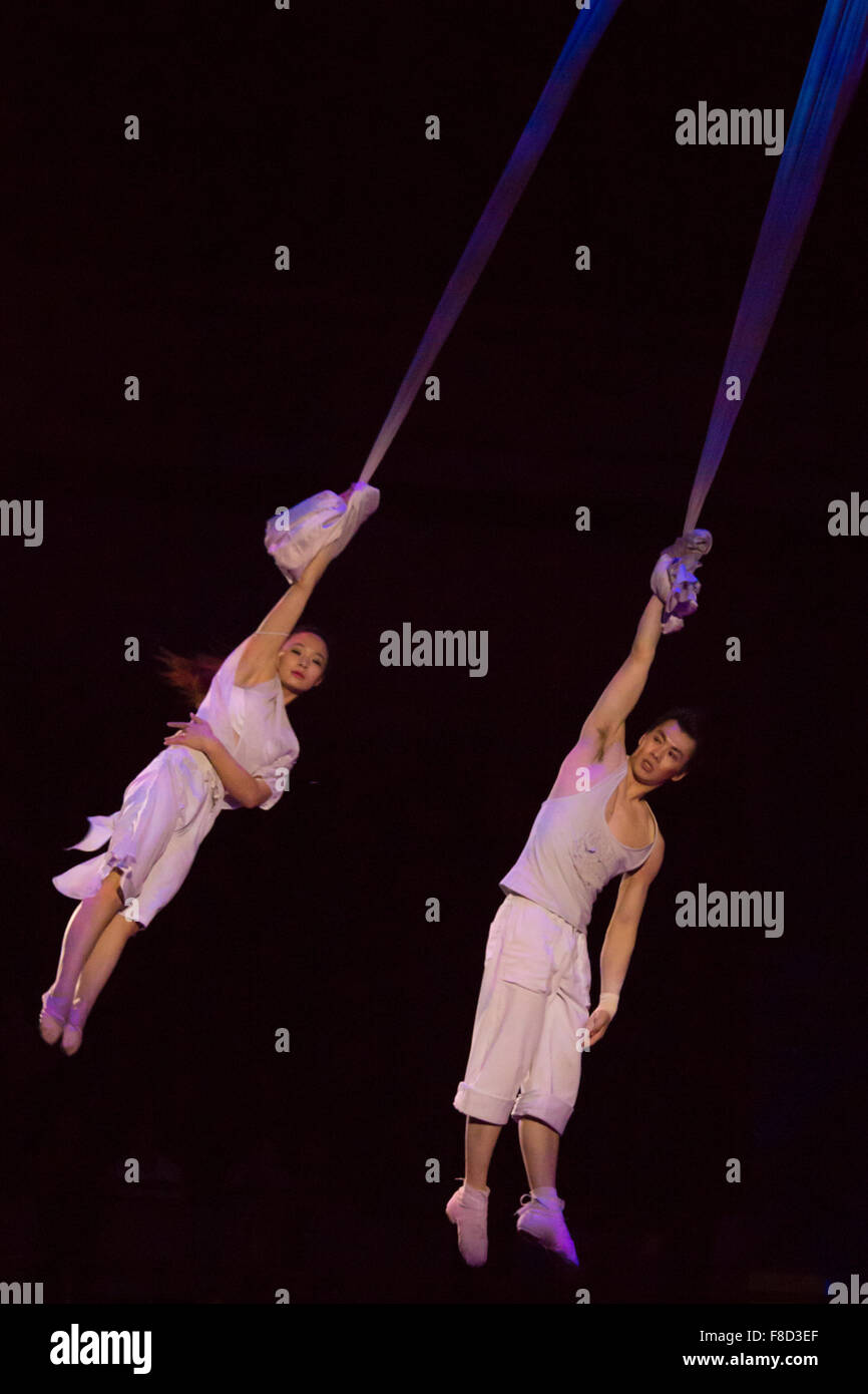 Acrobats hanging on a wire. China Stock Photo - Alamy