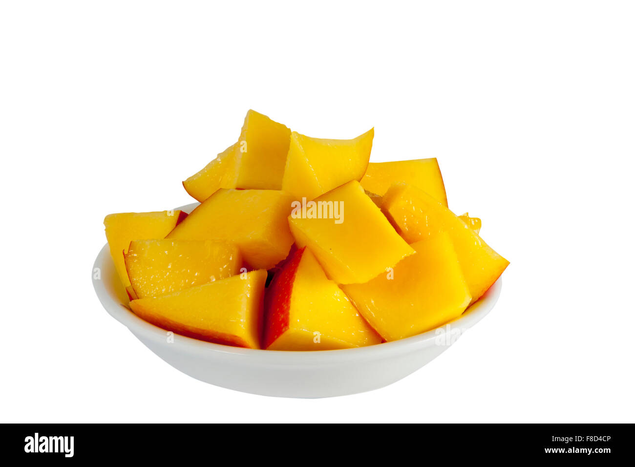 freshly cut cubed mango on a plate with white background Stock Photo ...
