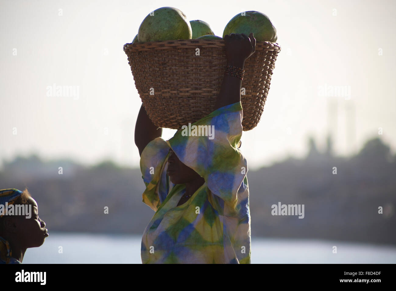 Woman carrying child street hi-res stock photography and images - Alamy